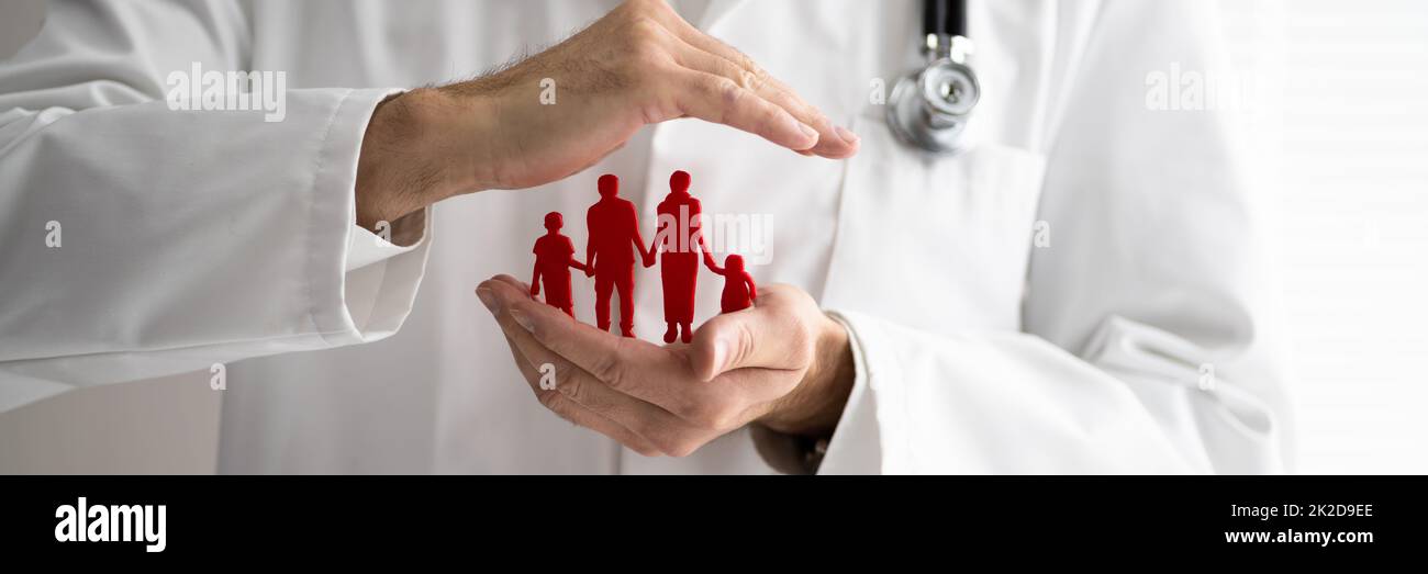 Doctor's Hand Holding Family Paper Cut Out Stock Photo - Alamy