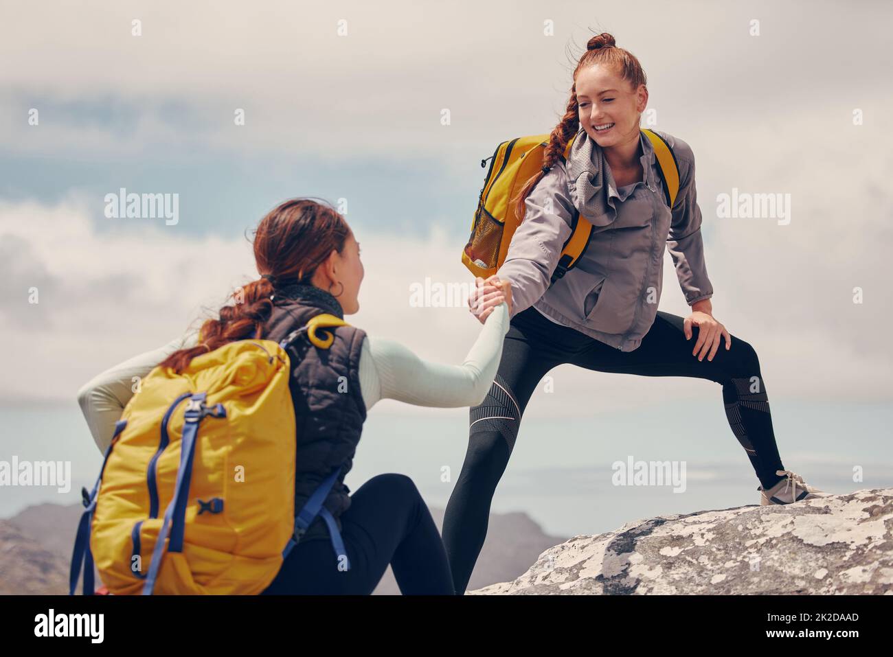 Help hands, friends or women hiking up a mountain, hill or in nature ...