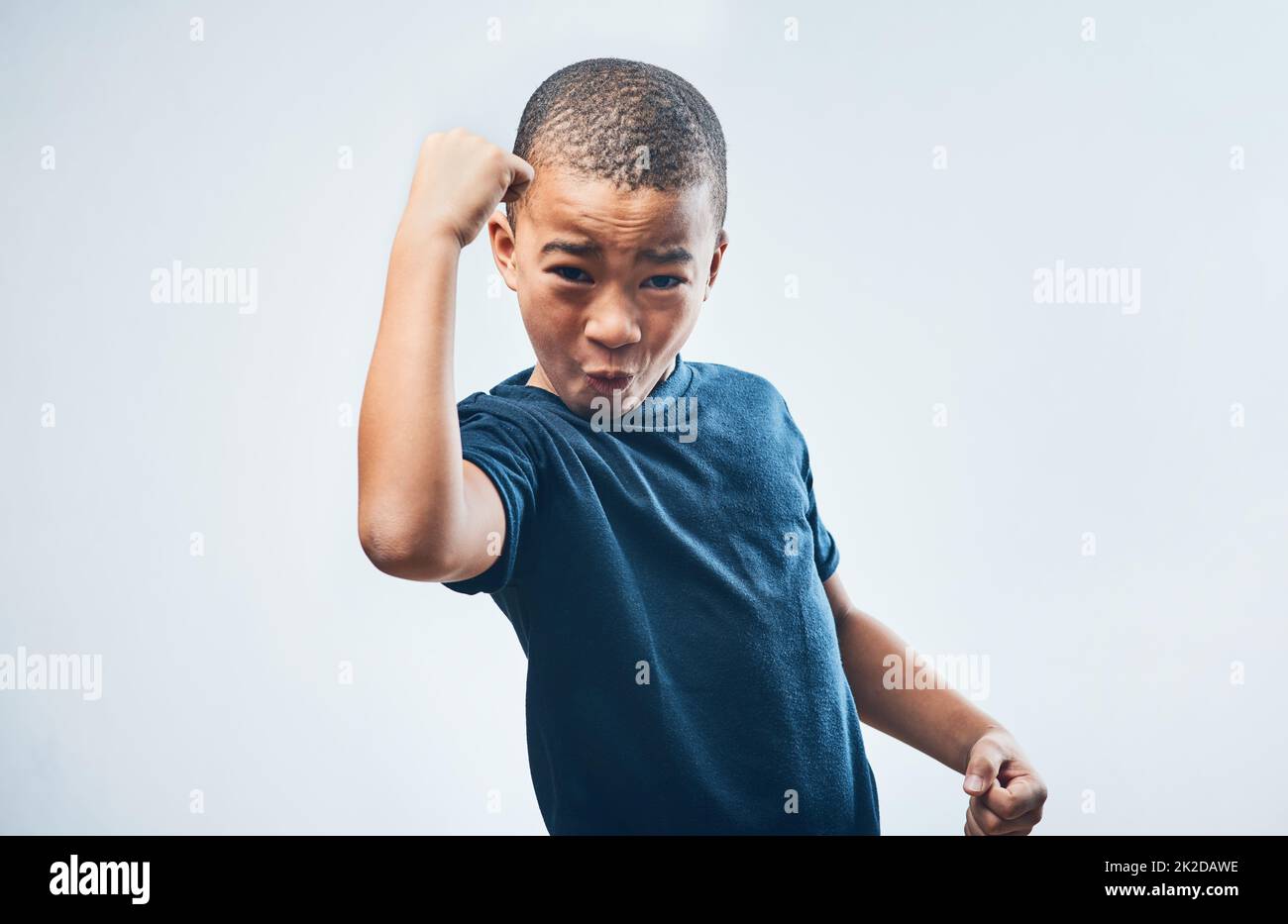 Boy flexing hi-res stock photography and images - Alamy