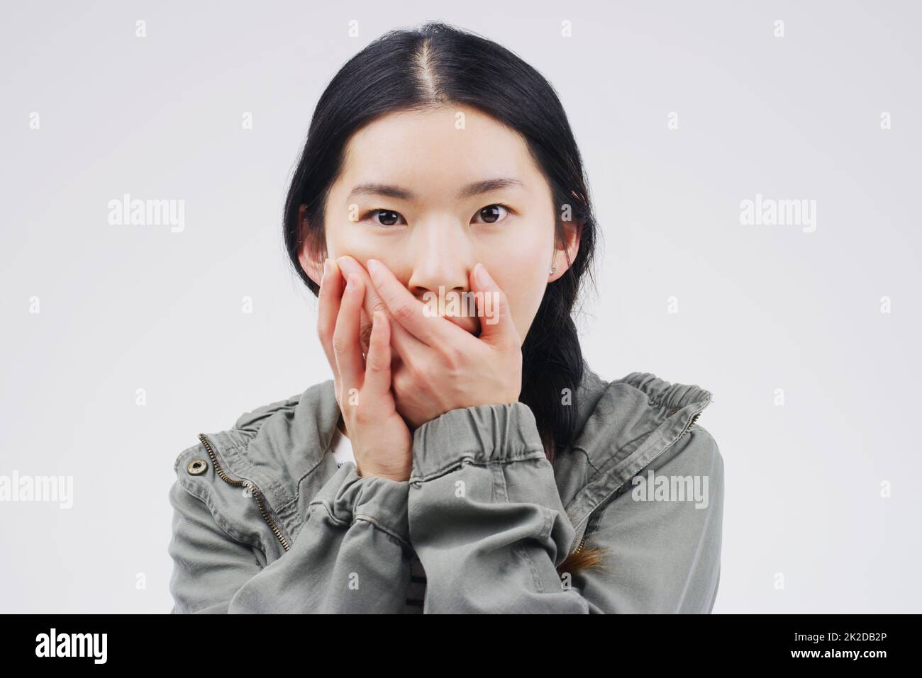 Woah How did you do that. Studio shot of a young woman looking shocked ...
