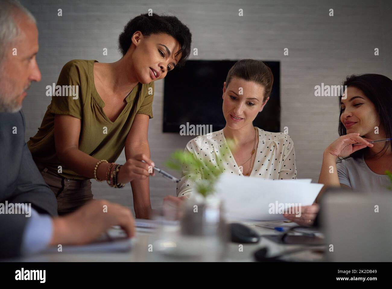 Explaining her ideas for moving forward. Shot of a group of colleagues ...