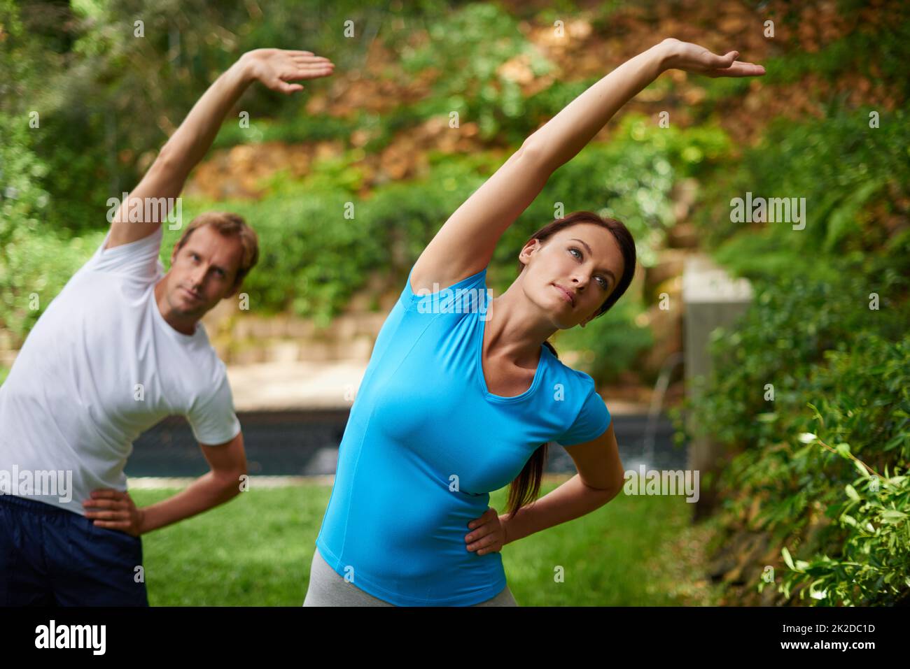 Woman stretch in garden hi-res stock photography and images - Alamy