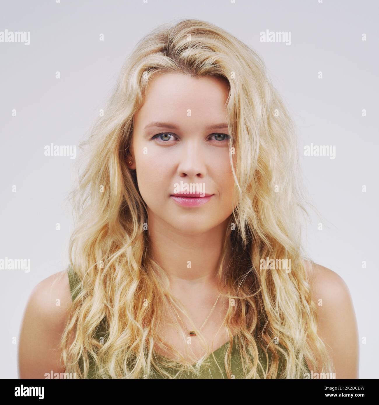 She gives nothing away. Studio portrait of an attractive young woman ...