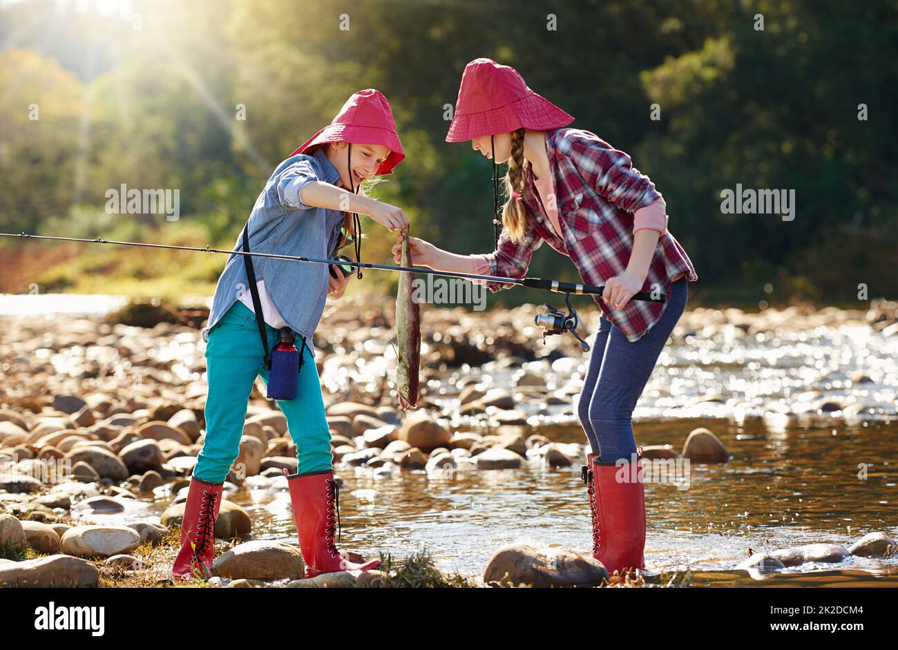 Two girls fishing hi-res stock photography and images - Alamy