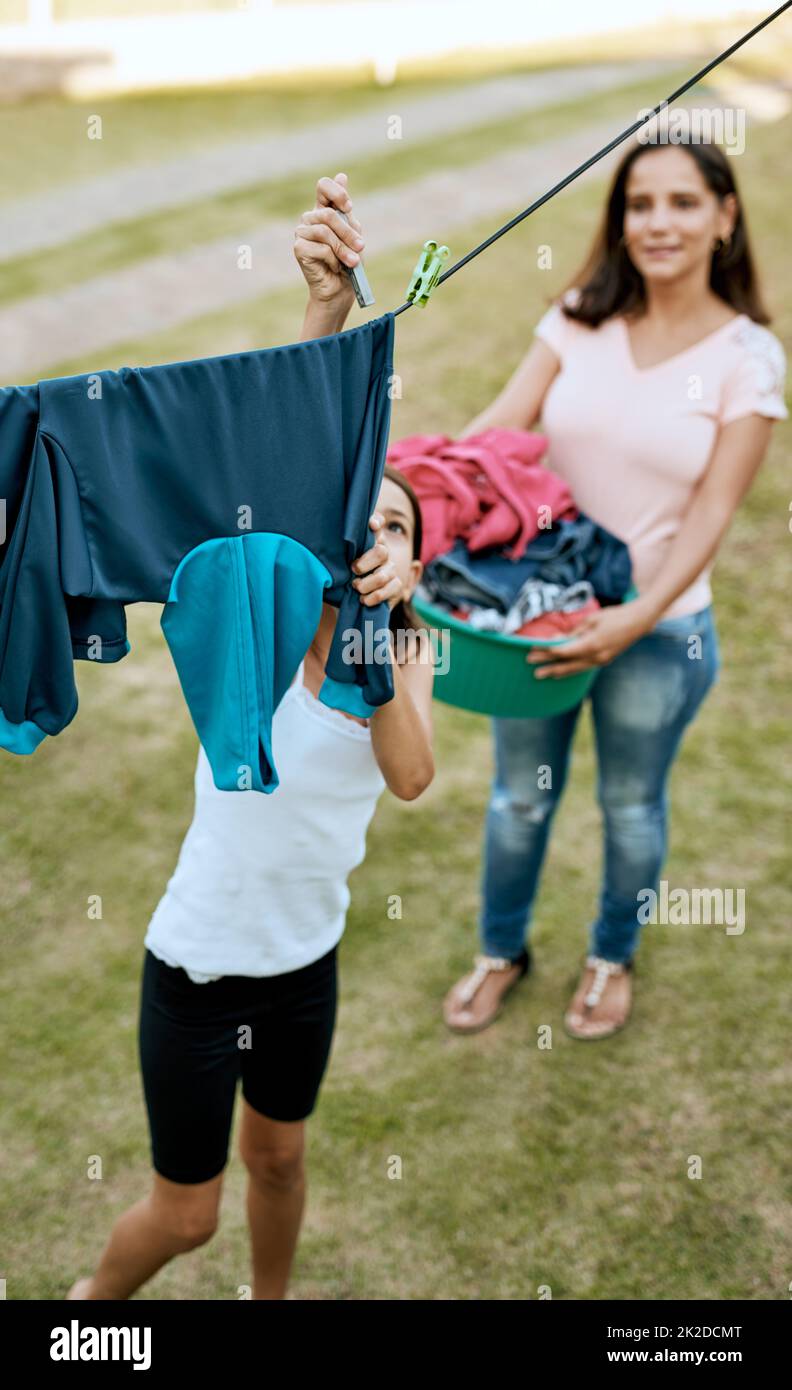 Woman hanging up washing hi-res stock photography and images - Alamy