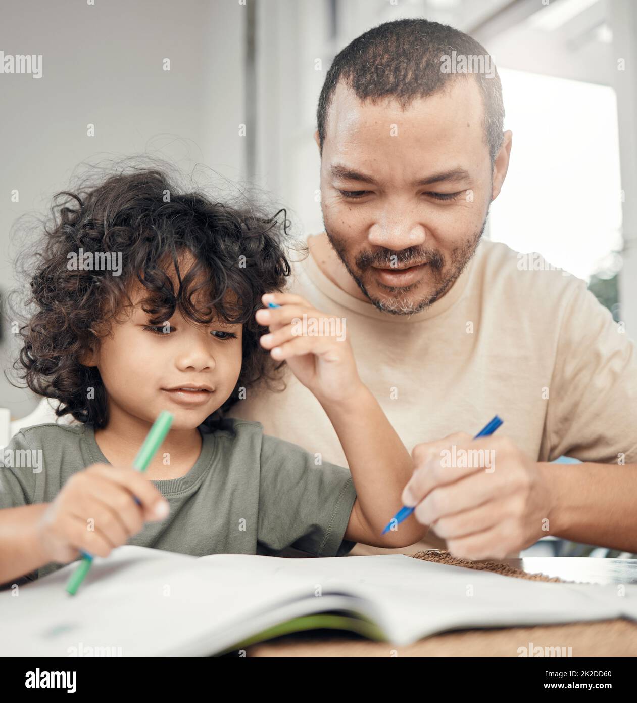Man helping boy homework hi-res stock photography and images - Alamy