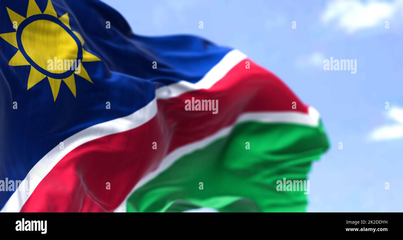 Detail of the national flag of Namibia waving in the wind on a clear ...