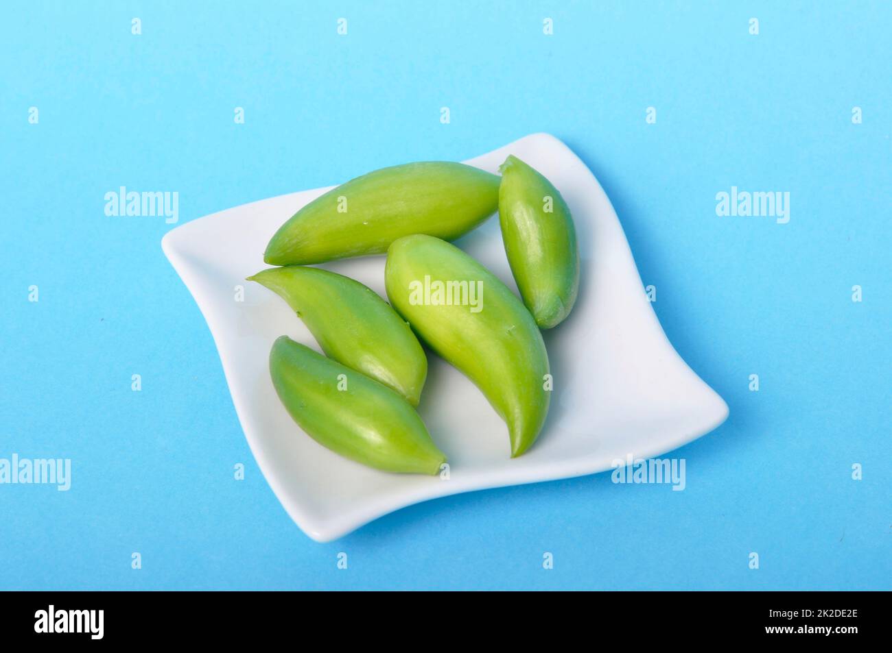 Achocha in a saucer on a blue background Stock Photo - Alamy