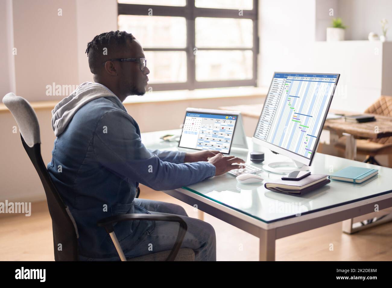 Employee Working On Calendar Schedule Stock Photo - Alamy
