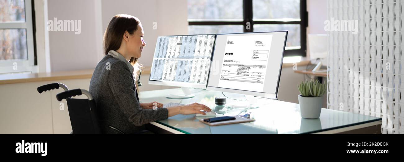 Disabled Person Working In Wheelchair Stock Photo - Alamy