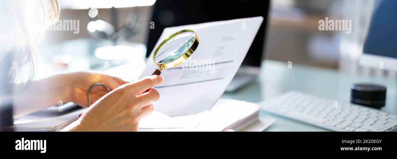 Lawyer Examining Paper Using Magnifier Glass Stock Photo - Alamy