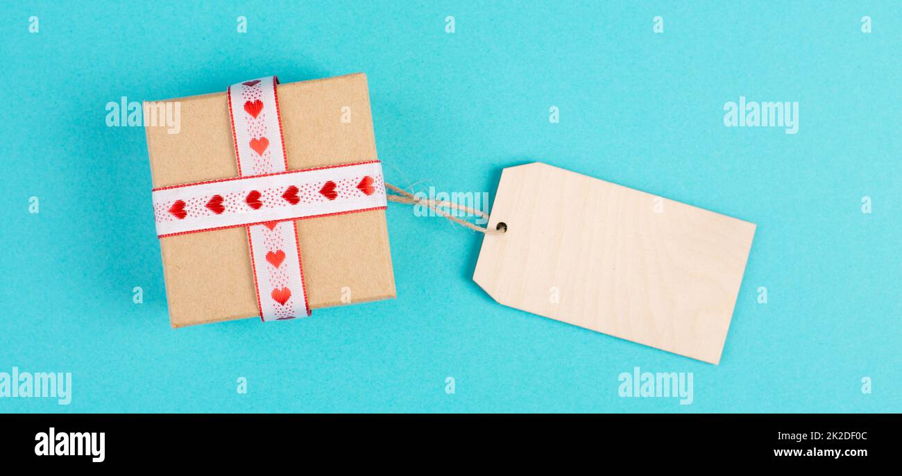 Little gift box with heart ribbon, copy space, background and greeting ...