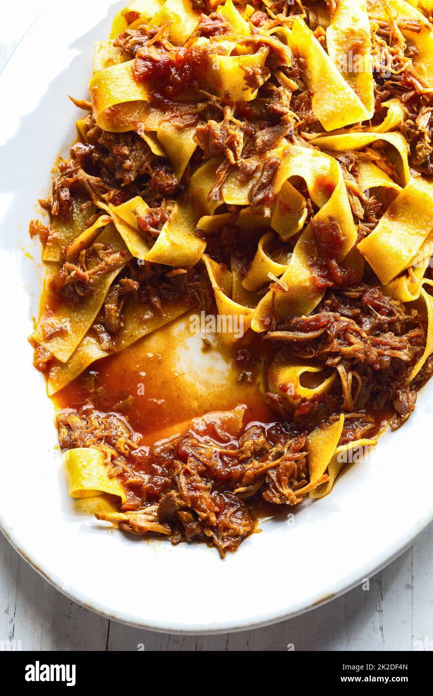 rustic italian pappardelle pasta in bolognese sauce Stock Photo - Alamy