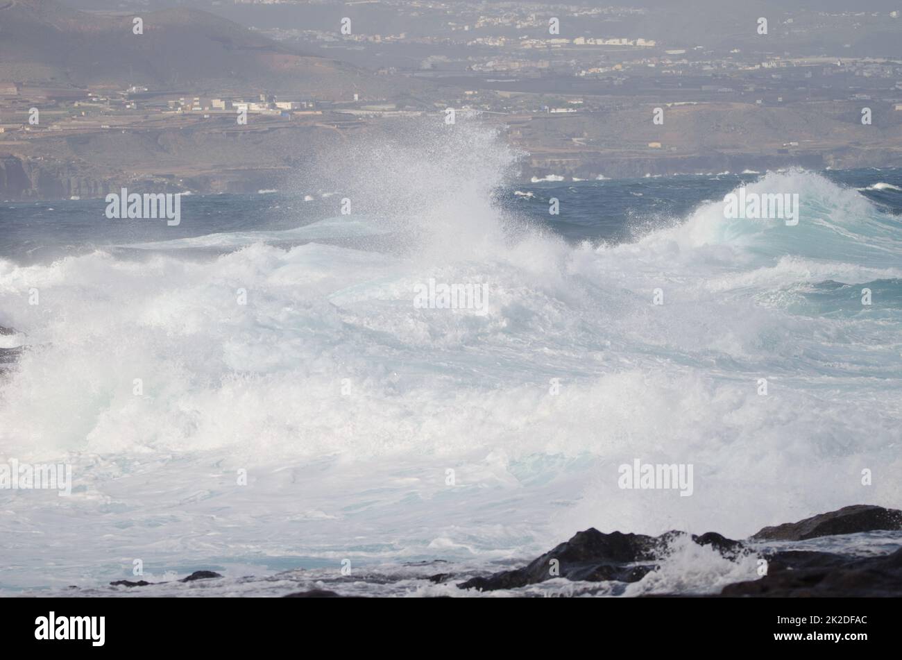 Waves breaking against the shore Stock Photo - Alamy
