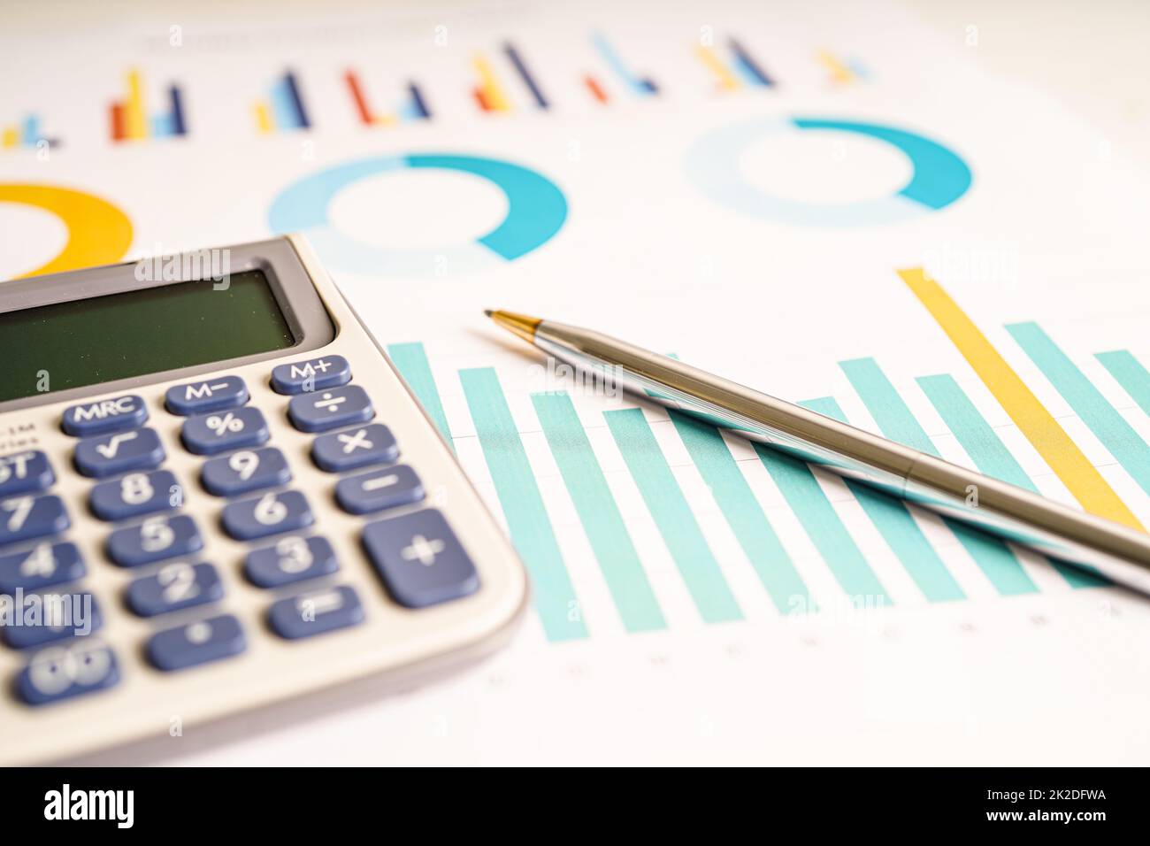 Calculator on chart and graph spreadsheet paper. Finance development ...