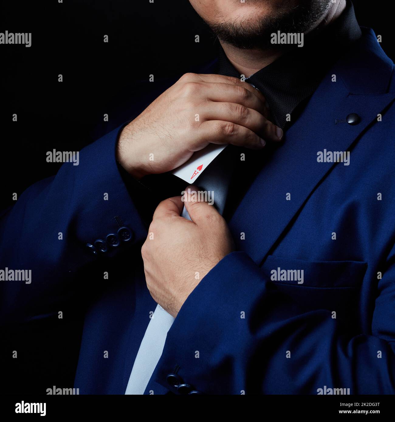 Magician illusionist showing performing card trick Stock Photo - Alamy