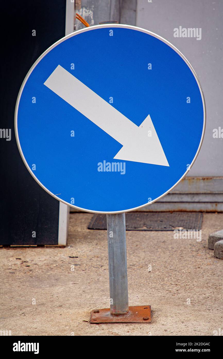 Arrow traffic sign in a circle Stock Photo - Alamy
