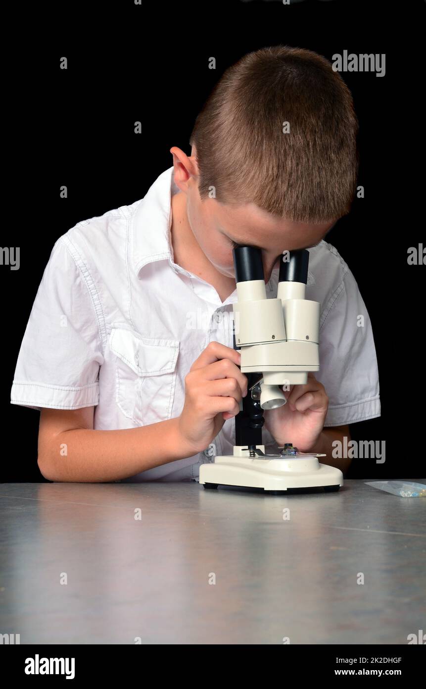 Young Boy Using a Microscope Stock Photo - Alamy
