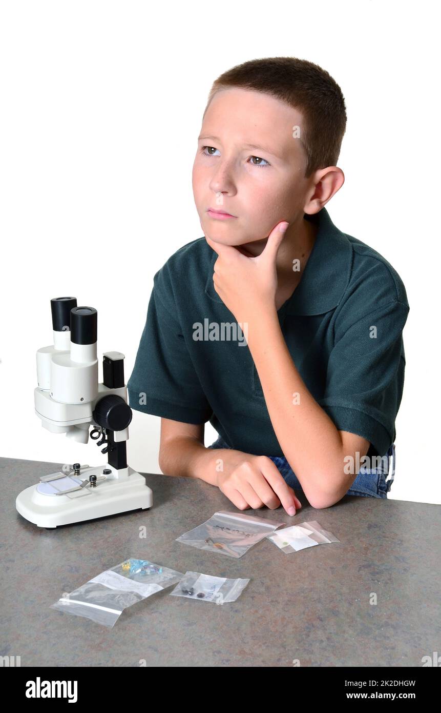 Young Boy Using a Microscope Stock Photo - Alamy