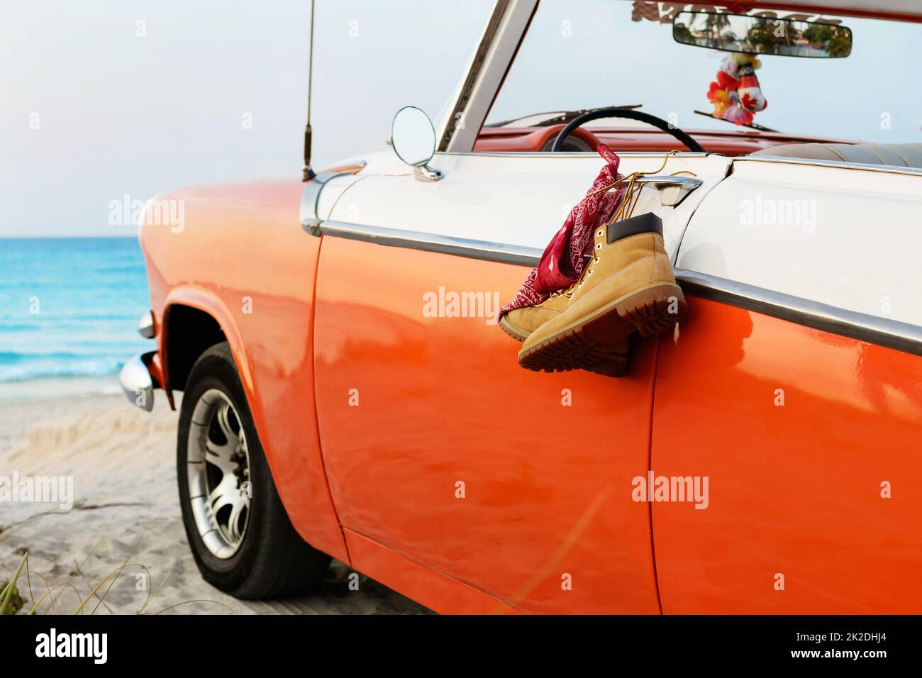 Retro car with tied boots and bandana to a door handle Stock Photo - Alamy
