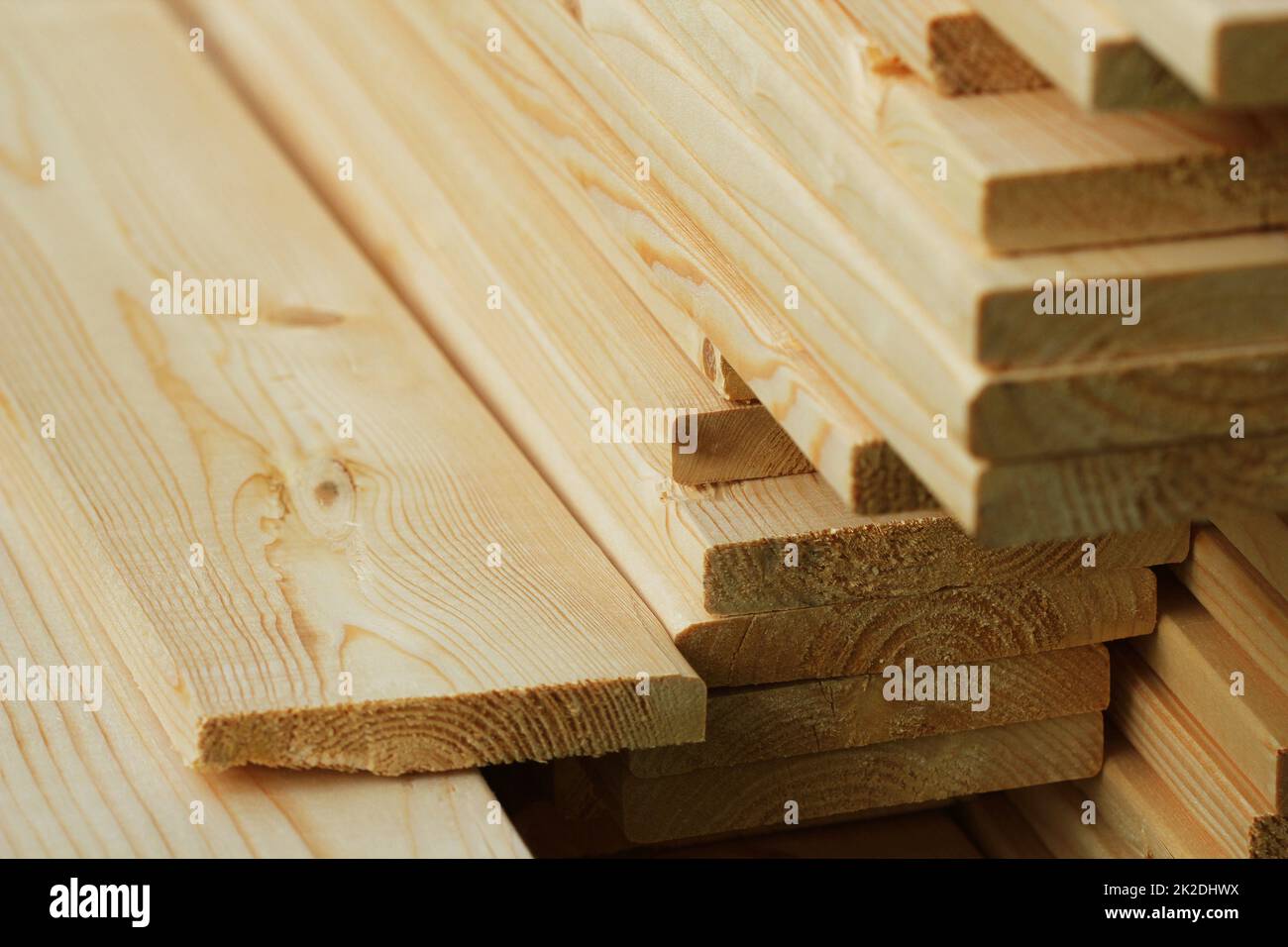 Pile of new wooden boards on a storage. Side background texture Stock ...