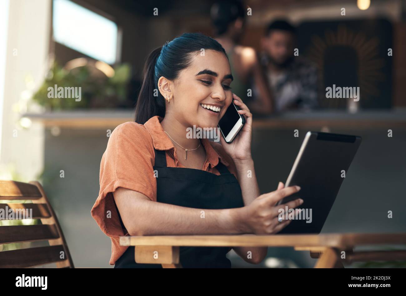 Of course we make large pizzas. Shot of an attractive young woman ...