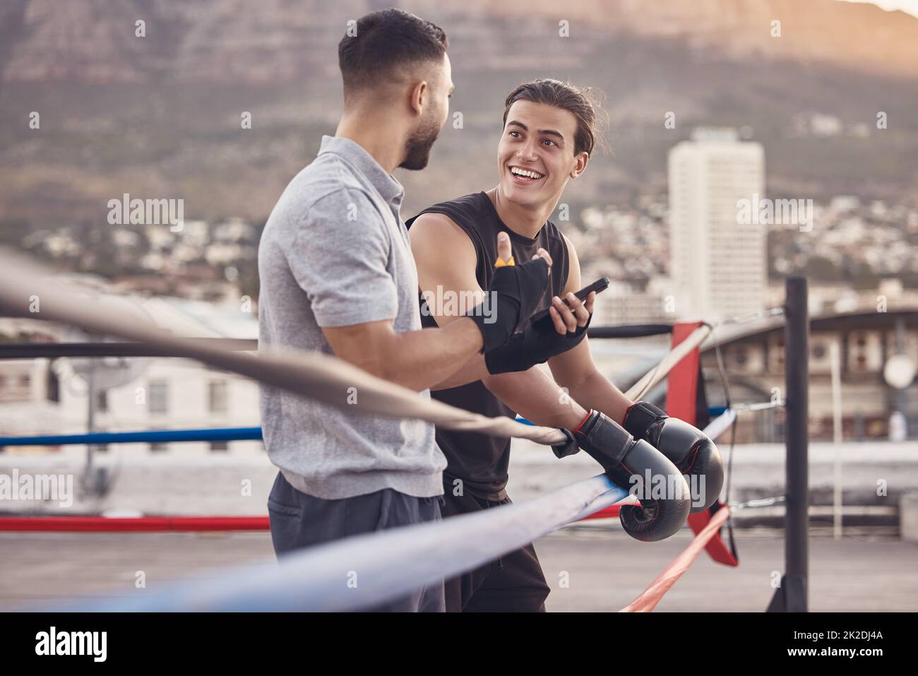 Boxing ring, strong men at outdoor gym talking fight strategy for ...