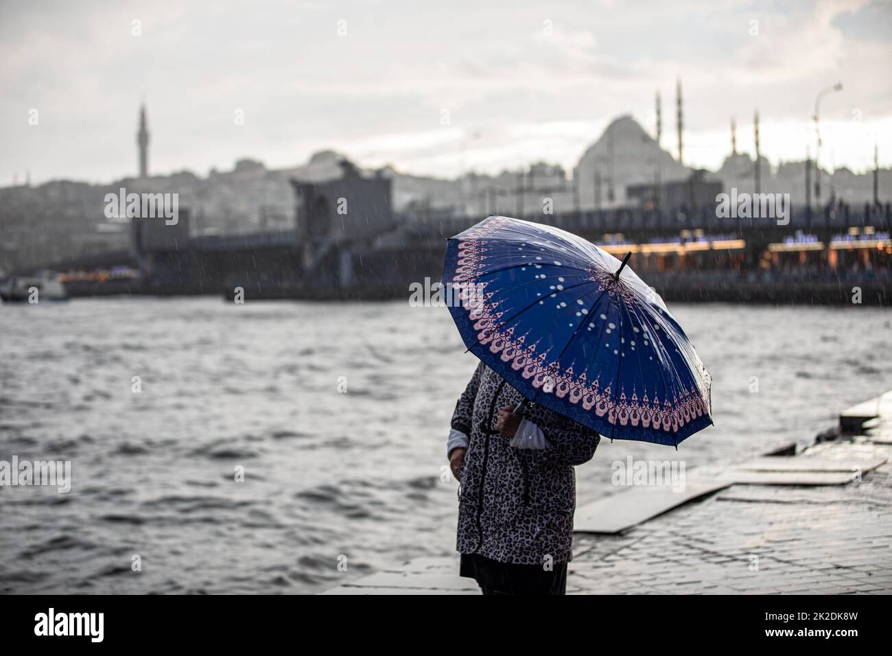 Istanbul, Turkey. 22nd Sep, 2022. A person walking with an umbrella ...
