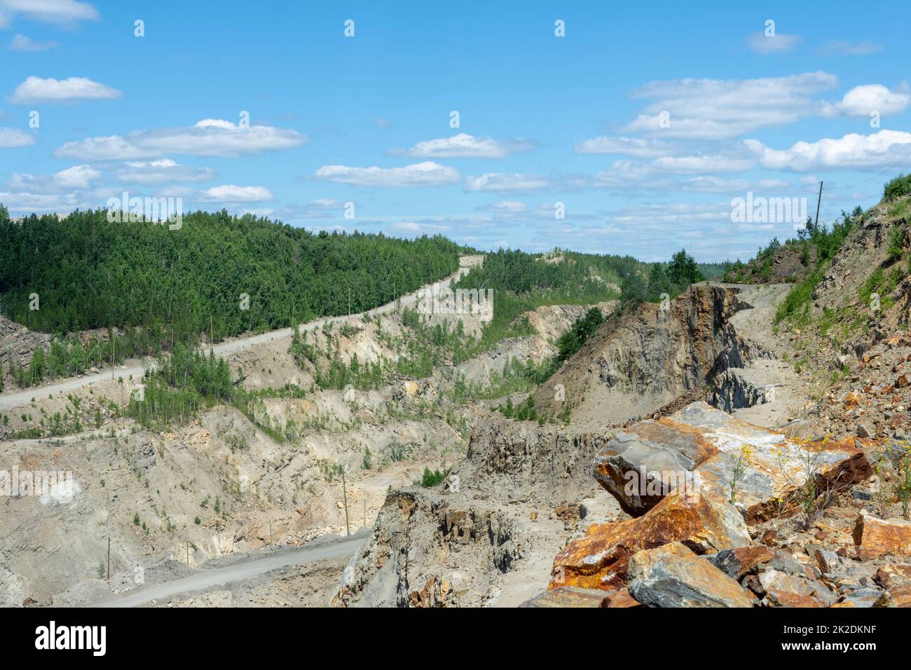 The production of graphite. Industrial background. Deep quarry for the ...