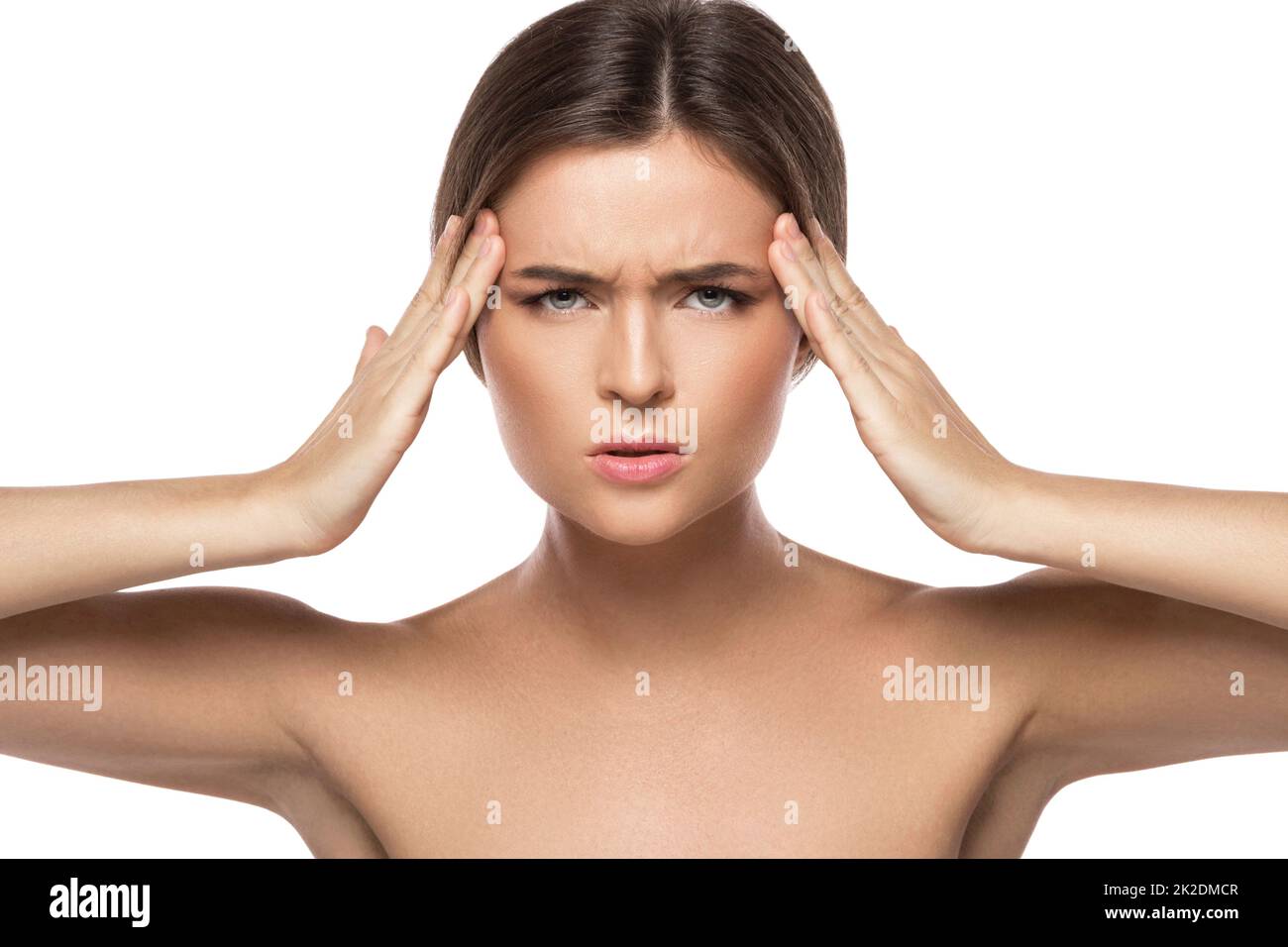 Woman with a headache on white background Stock Photo - Alamy