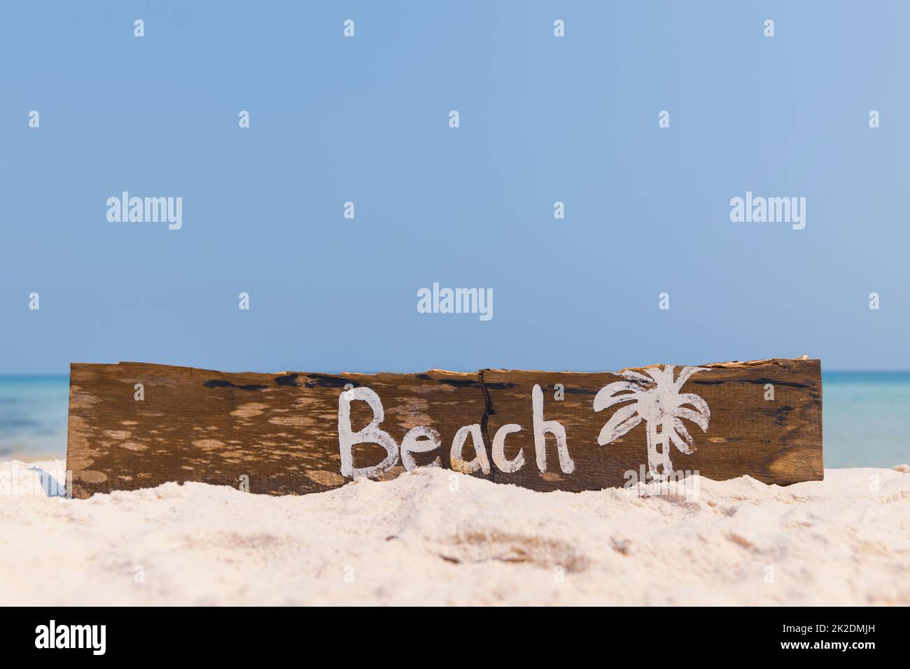 Wooden sign with lettering on the beach Stock Photo - Alamy