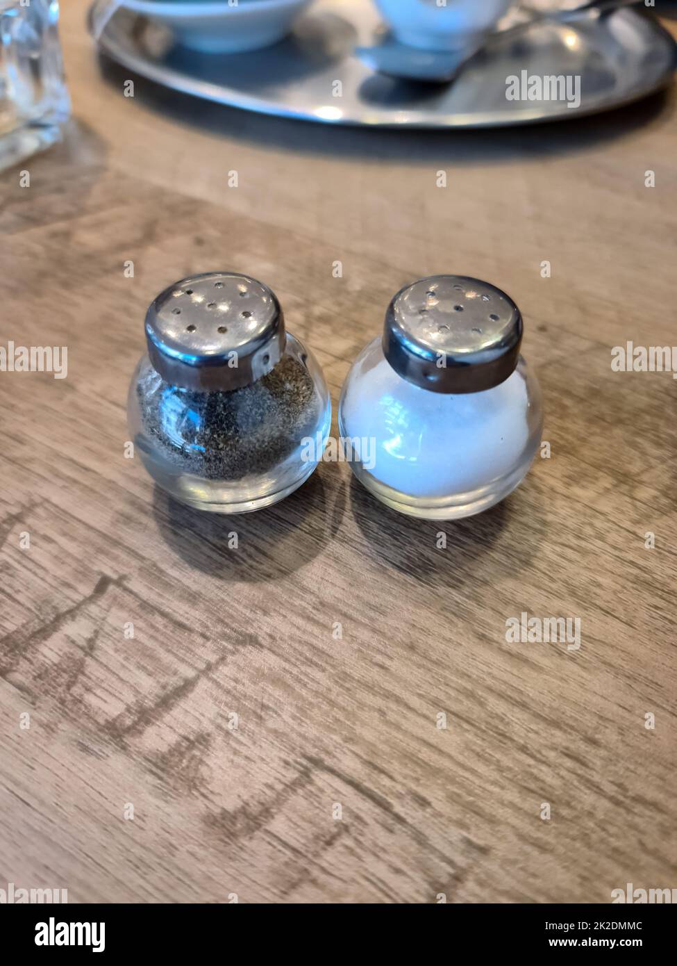 Salt and pepper shaker on old table top taken from above Stock Photo ...