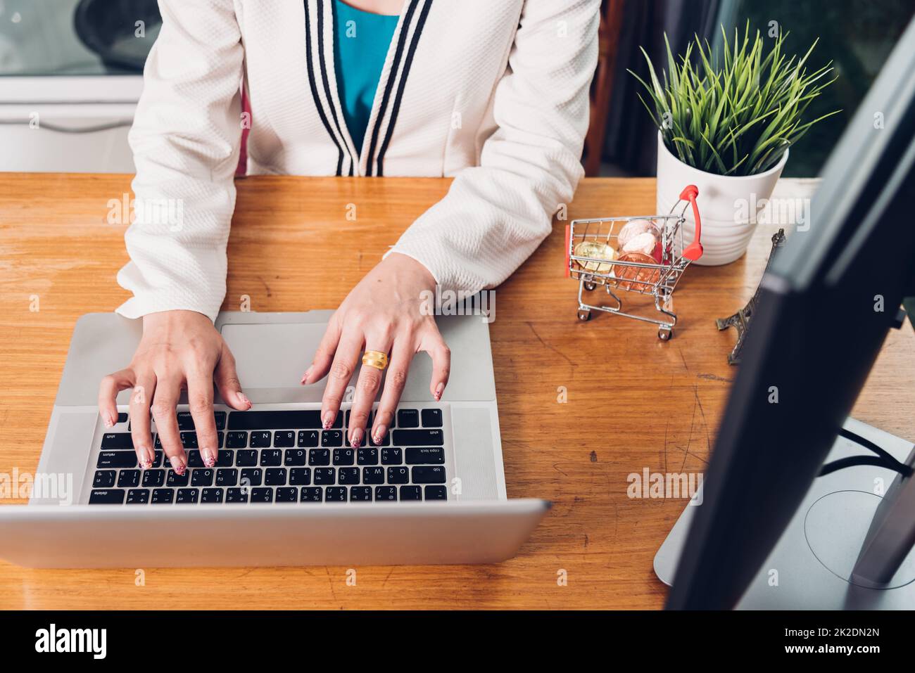 Young business woman working typing laptop computer Stock Photo - Alamy
