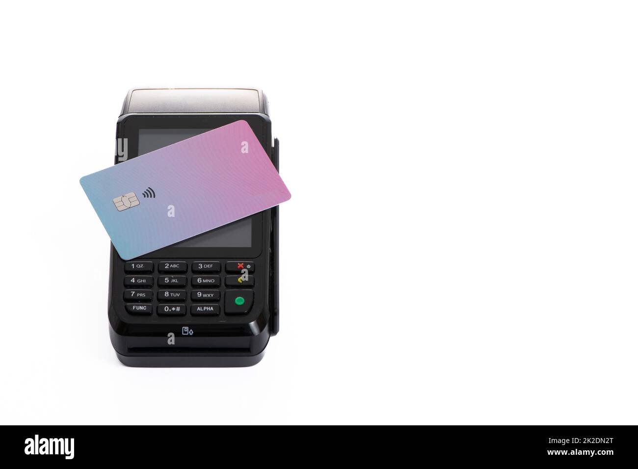 the plastic card lies on the payment terminal with a white isolated ...