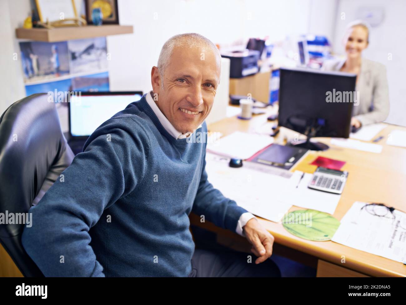 Years of industry experience. Shot of a two people working at their ...