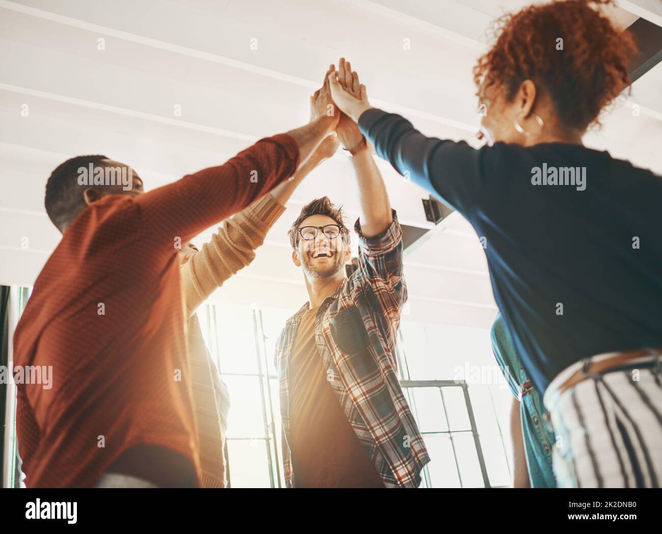 Coworkers high five hi-res stock photography and images - Alamy