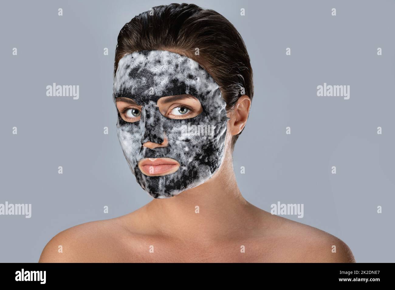 Woman with bubble sheet mask on her face Stock Photo - Alamy