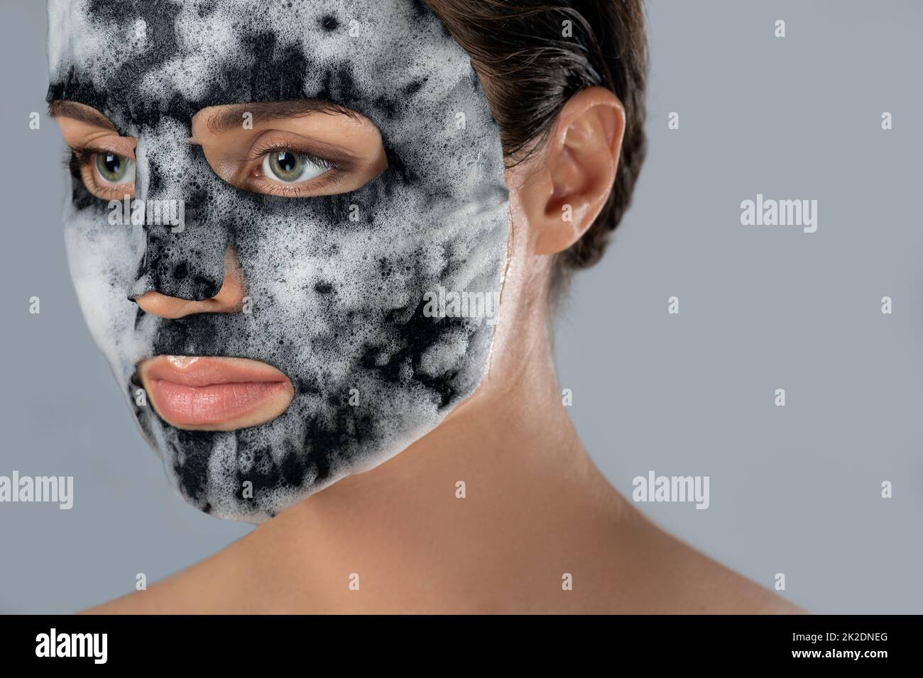 Woman with bubble sheet mask on her face Stock Photo - Alamy