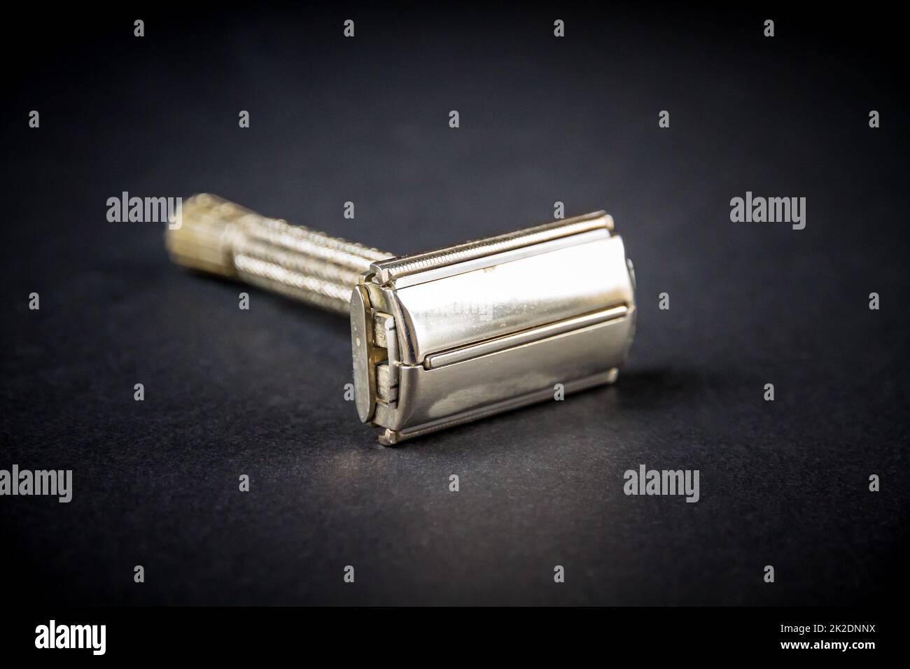 Old vintage shaver on a black background Stock Photo - Alamy
