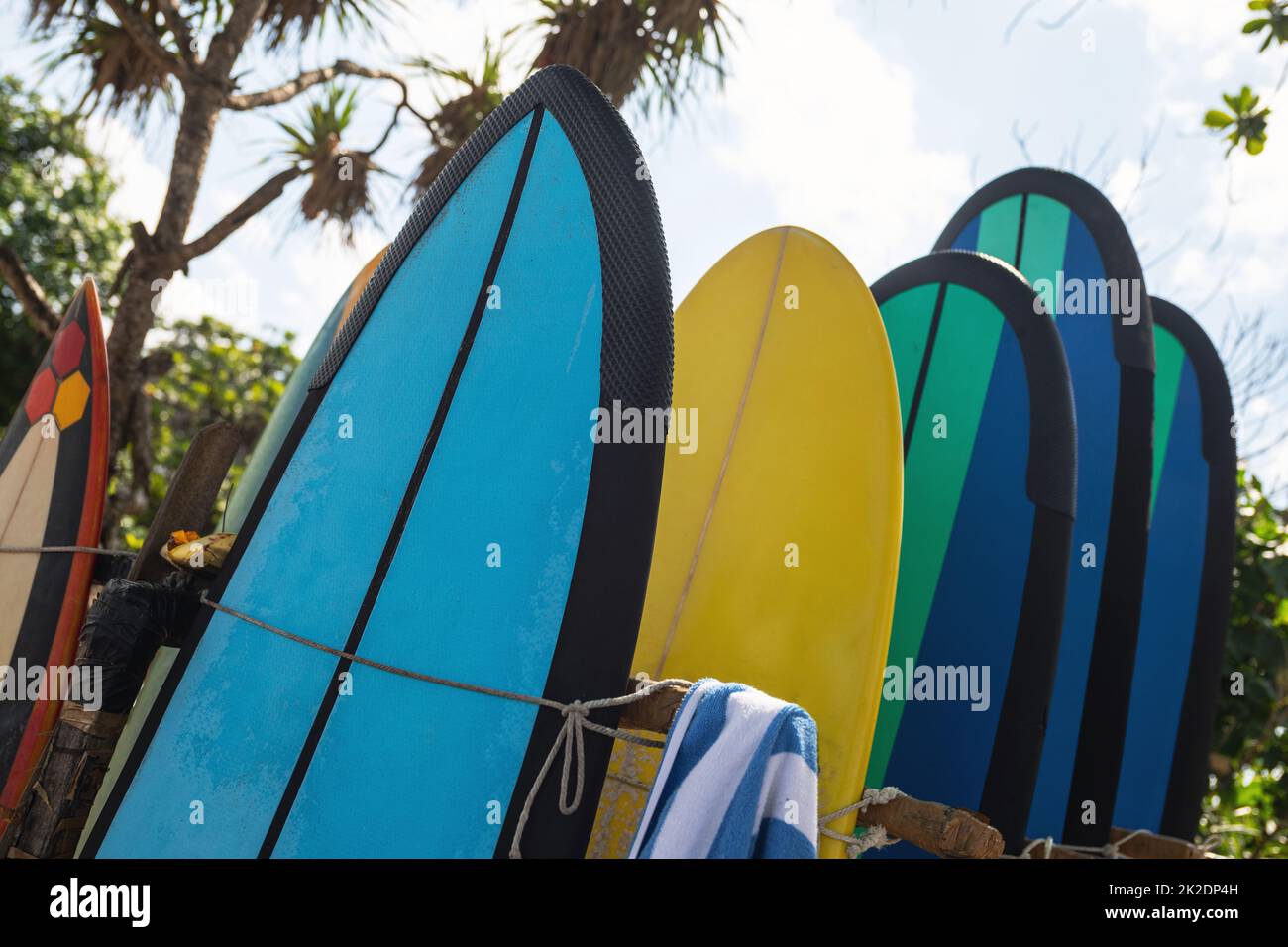 Stack of different surfboard for a rental on the beach Stock Photo - Alamy