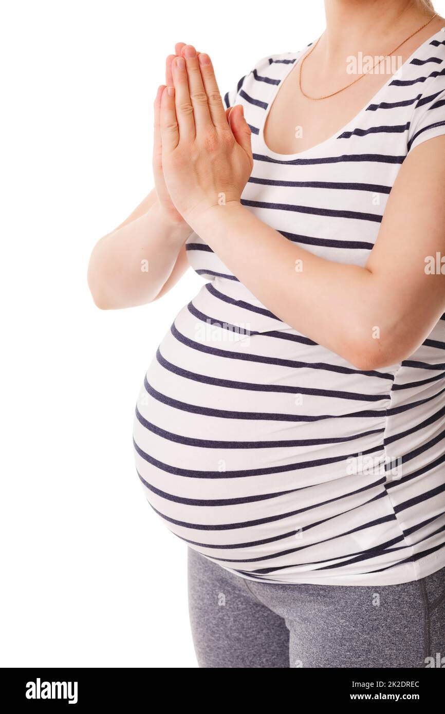 Pregnant woman doing yoga asana asana Tadasana namaste -Mountain pose ...
