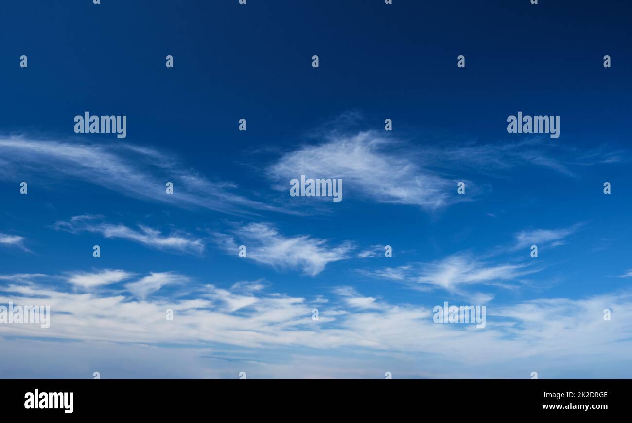 Blue clear sky with clouds Stock Photo - Alamy
