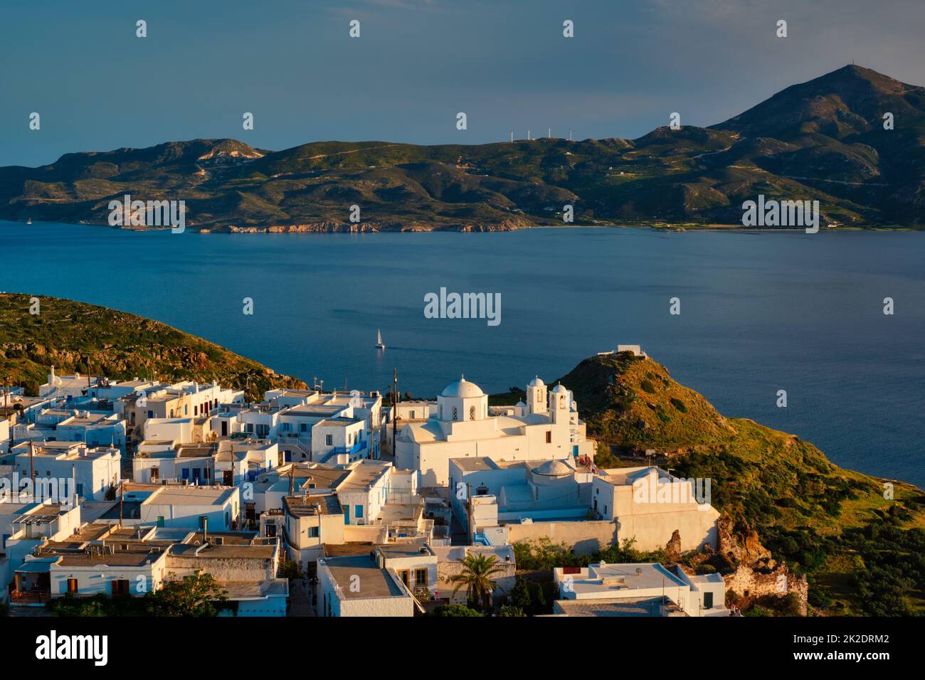 View of Plaka village on Milos island on sunset in Greece Stock Photo ...