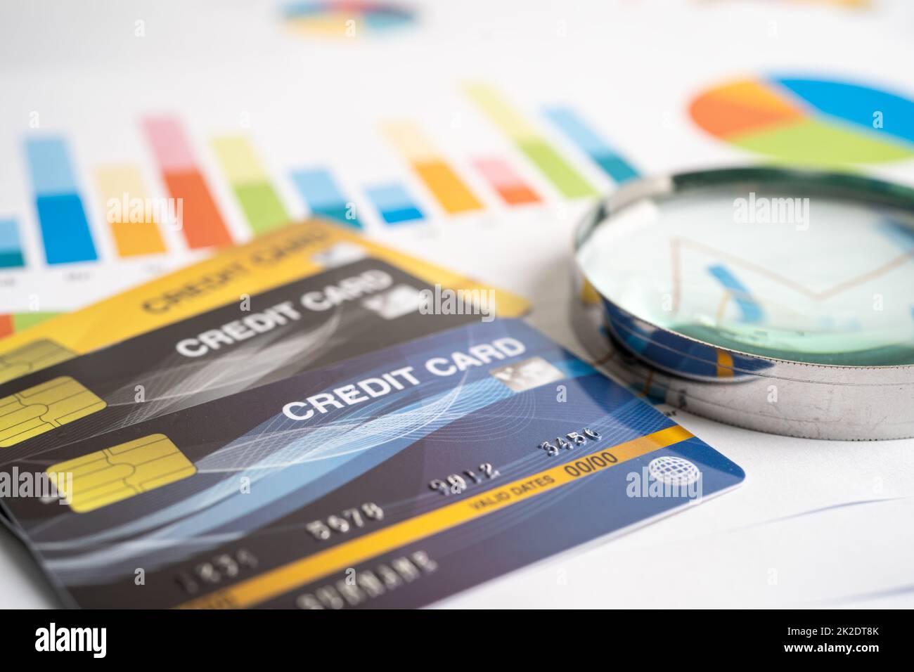 Credit card on chart and graph paper. Finance development, Banking ...