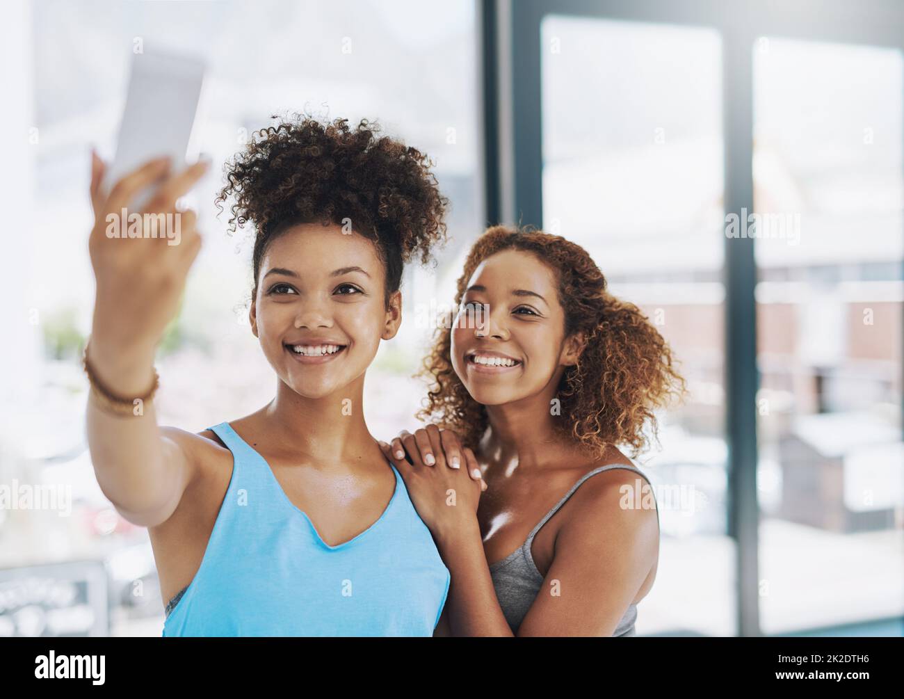Post Yoga Selfies Cropped Shot Of Two Young Women Taking A Selfie