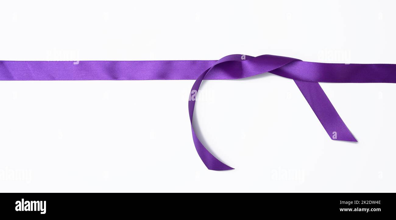 purple silk ribbon tied on white background, decor Stock Photo - Alamy