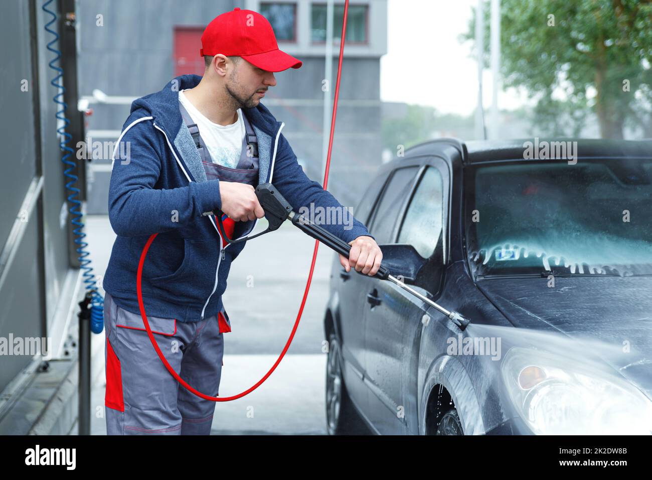 Car wash worker is washing client's car Stock Photo - Alamy
