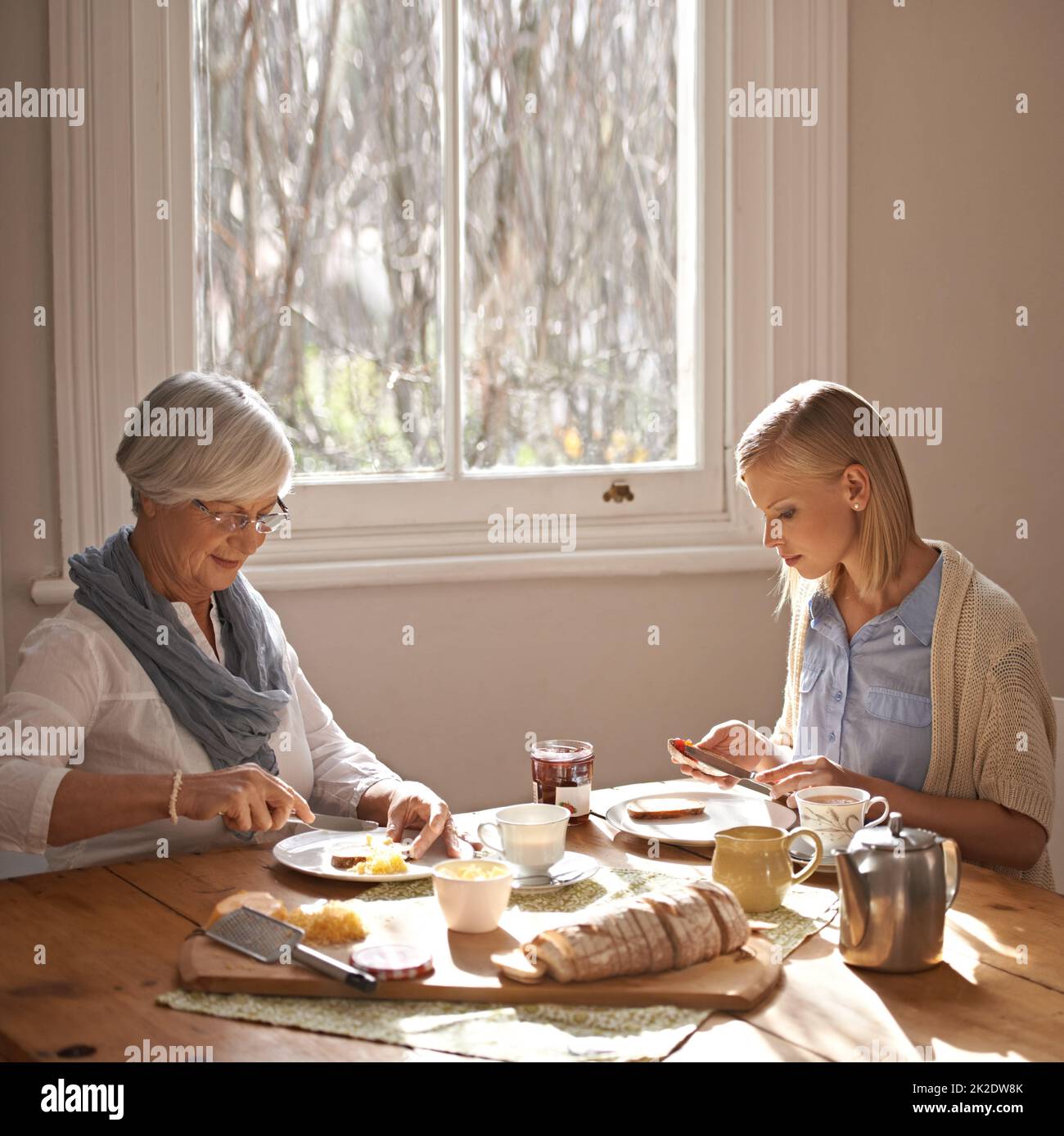 Old woman eating bread hi-res stock photography and images - Alamy