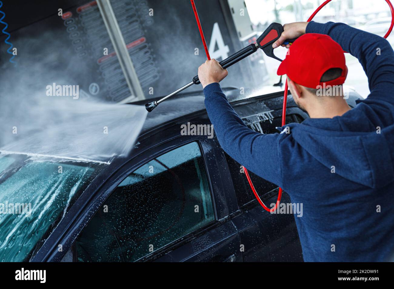 Car wash worker is washing client's car Stock Photo - Alamy