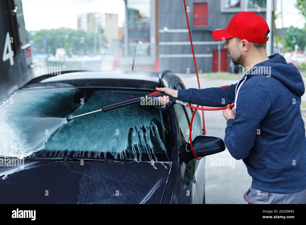 Car wash worker is washing client's car Stock Photo - Alamy